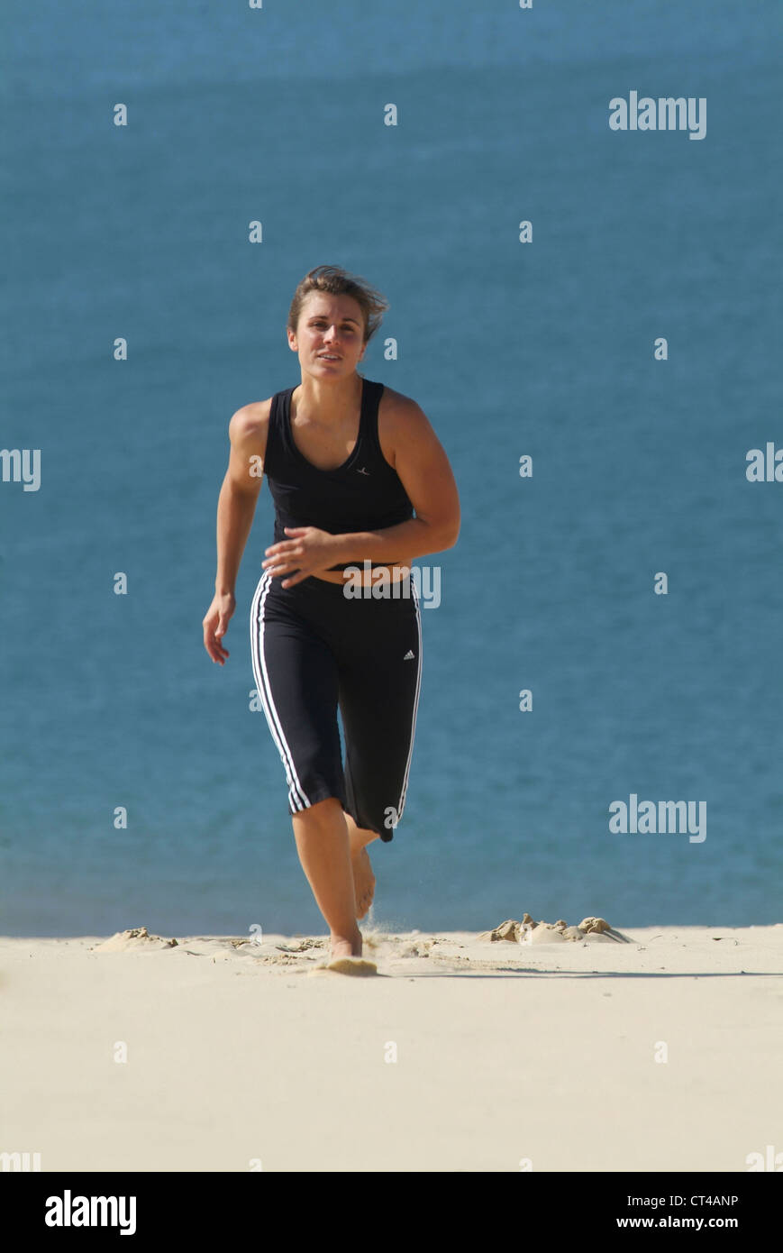 Female running beach alone activity hi-res stock photography and images ...