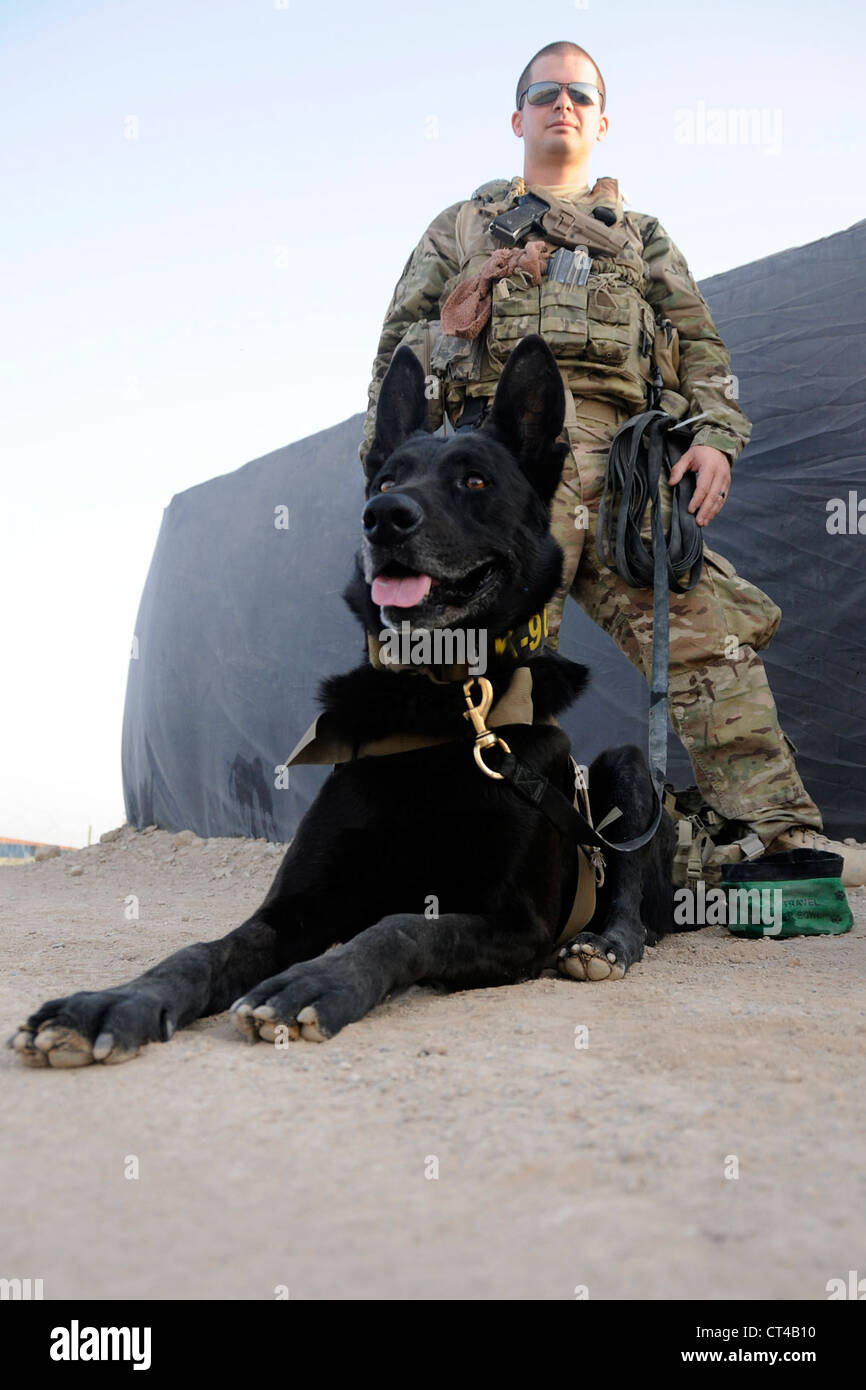 U.S. Air Force Staff Sgt. Larry Harris, a Military Working Dog handler ...
