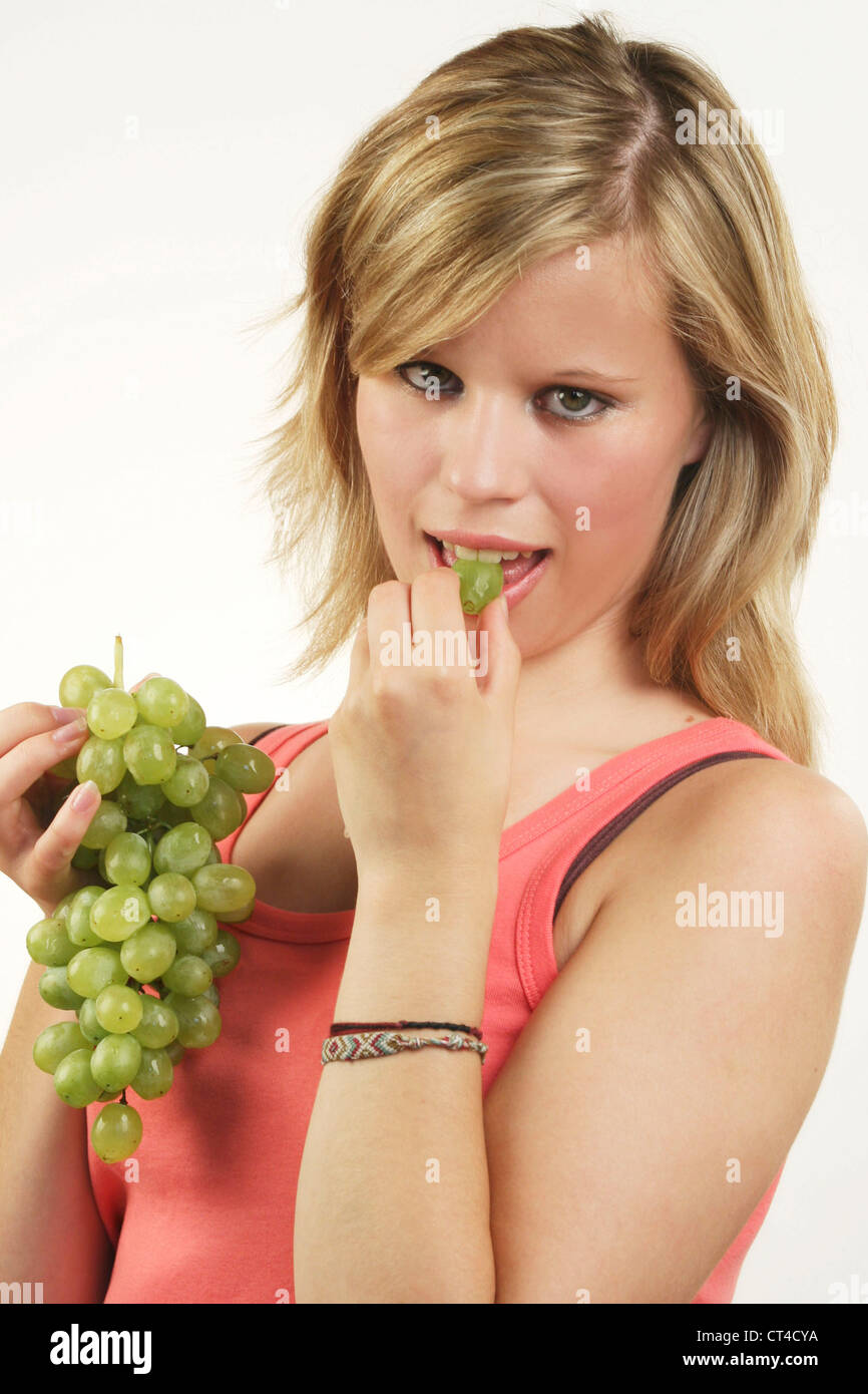 WOMAN EATING FRUIT Stock Photo - Alamy