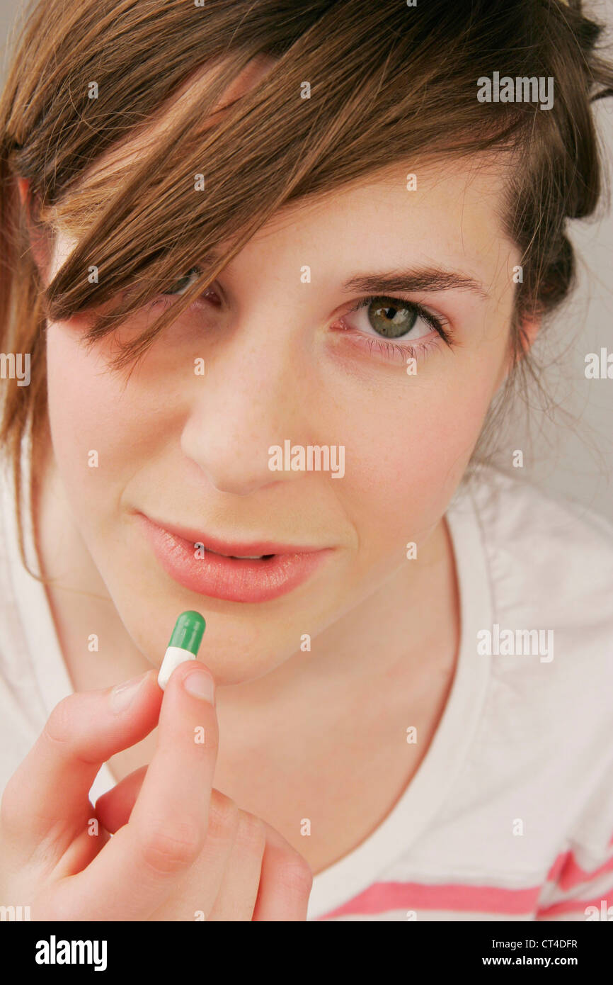 ADOLESCENT TAKING MEDICATION Stock Photo - Alamy