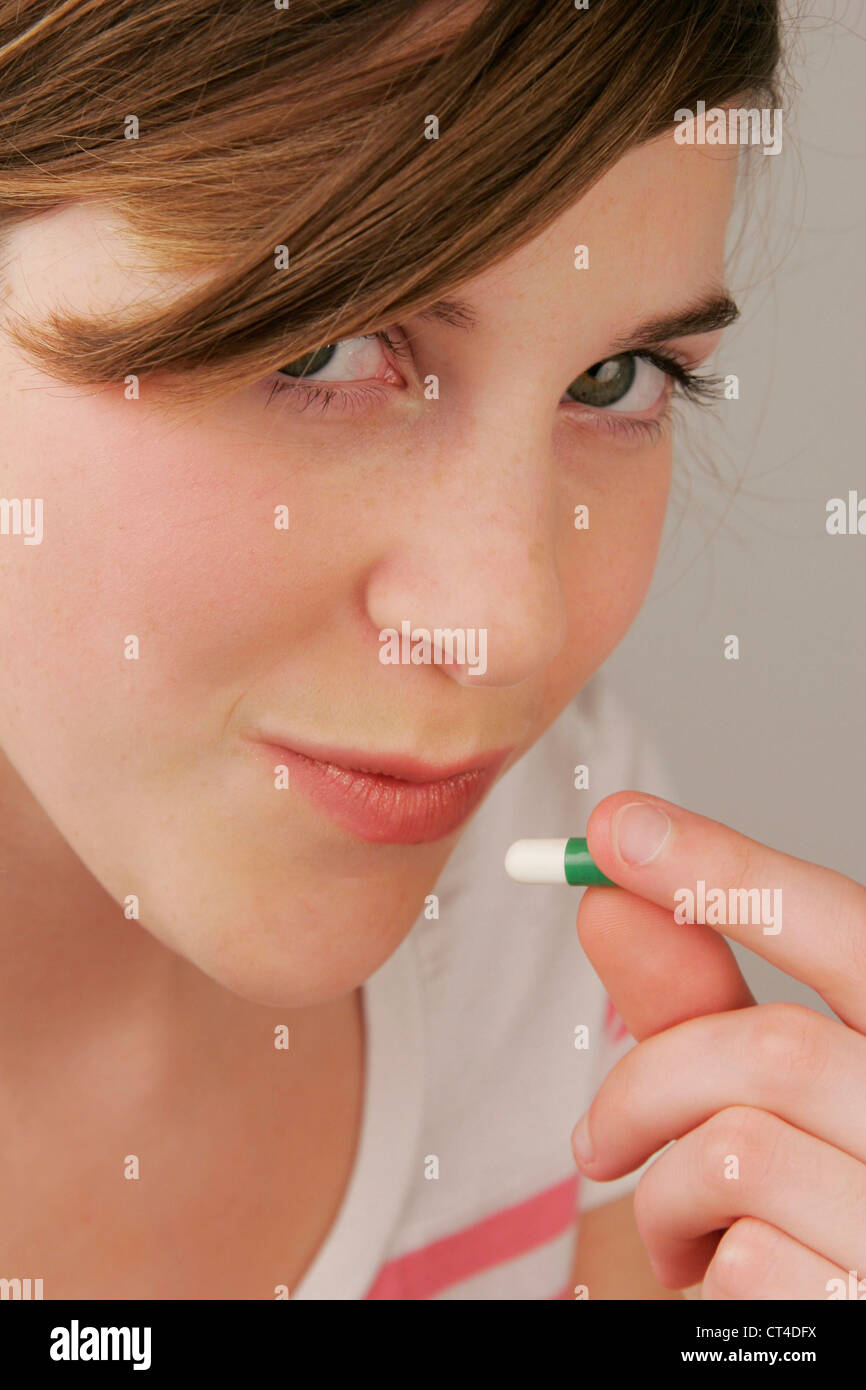ADOLESCENT TAKING MEDICATION Stock Photo - Alamy