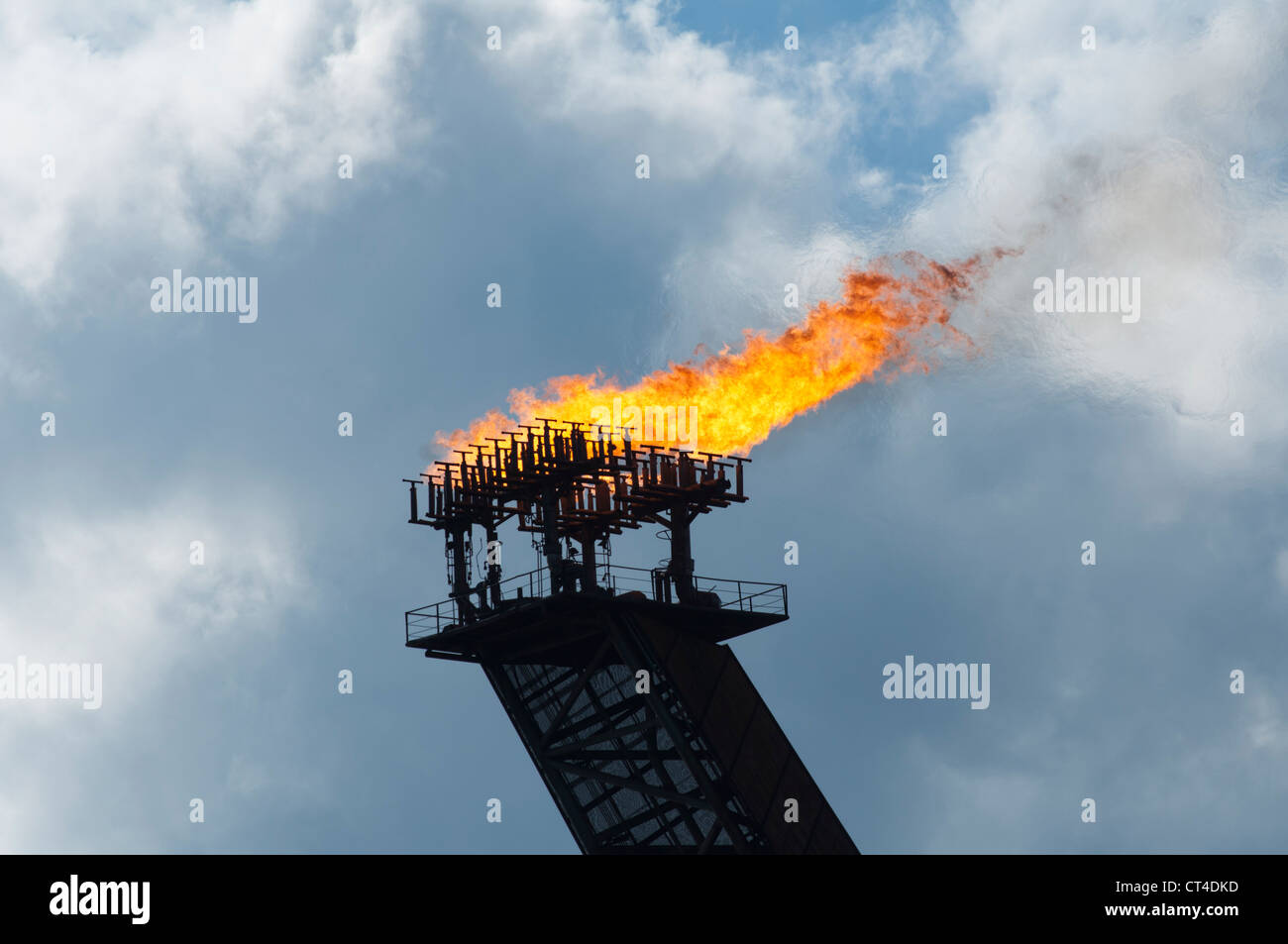 Flare of an FPSO oil rig in offshore area. Burning gas in Campos Basin ...