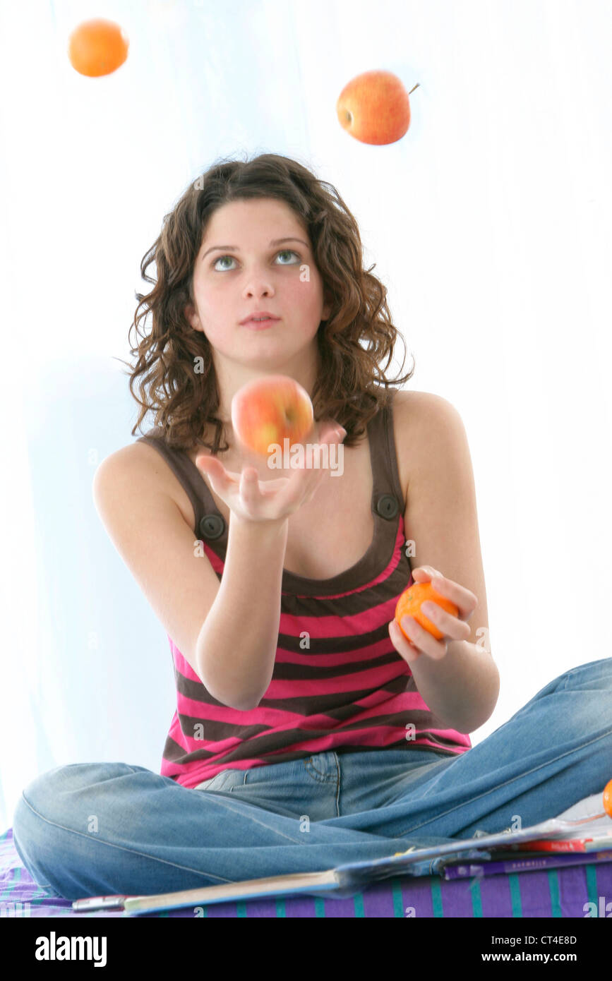 ADOLESCENT EATING FRUIT Stock Photo - Alamy
