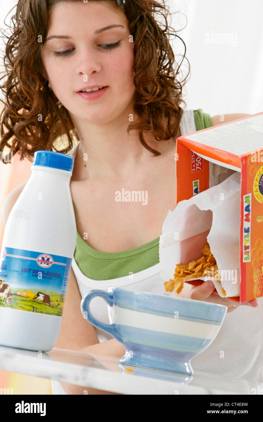 ADOLESCENT EATING BREAKFAST Stock Photo - Alamy