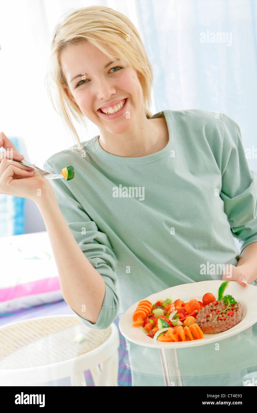 ADOLESCENT EATING A MEAL Stock Photo - Alamy