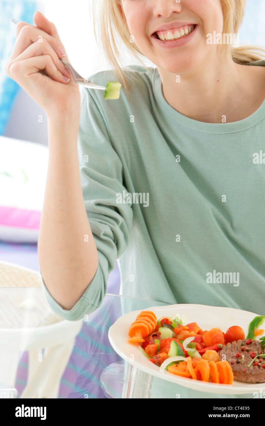 ADOLESCENT EATING A MEAL Stock Photo - Alamy