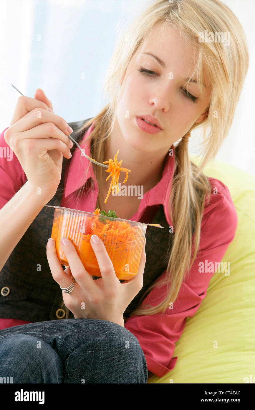 ADOLESCENT EATING SALAD Stock Photo - Alamy