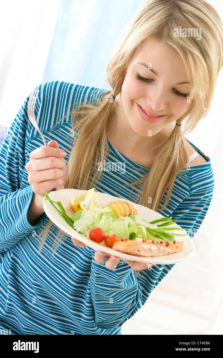 ADOLESCENT EATING A MEAL Stock Photo - Alamy