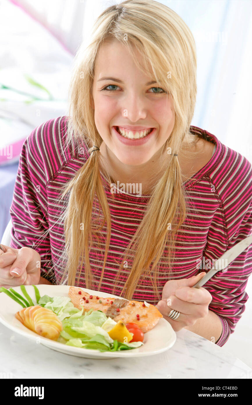 ADOLESCENT EATING A MEAL Stock Photo - Alamy