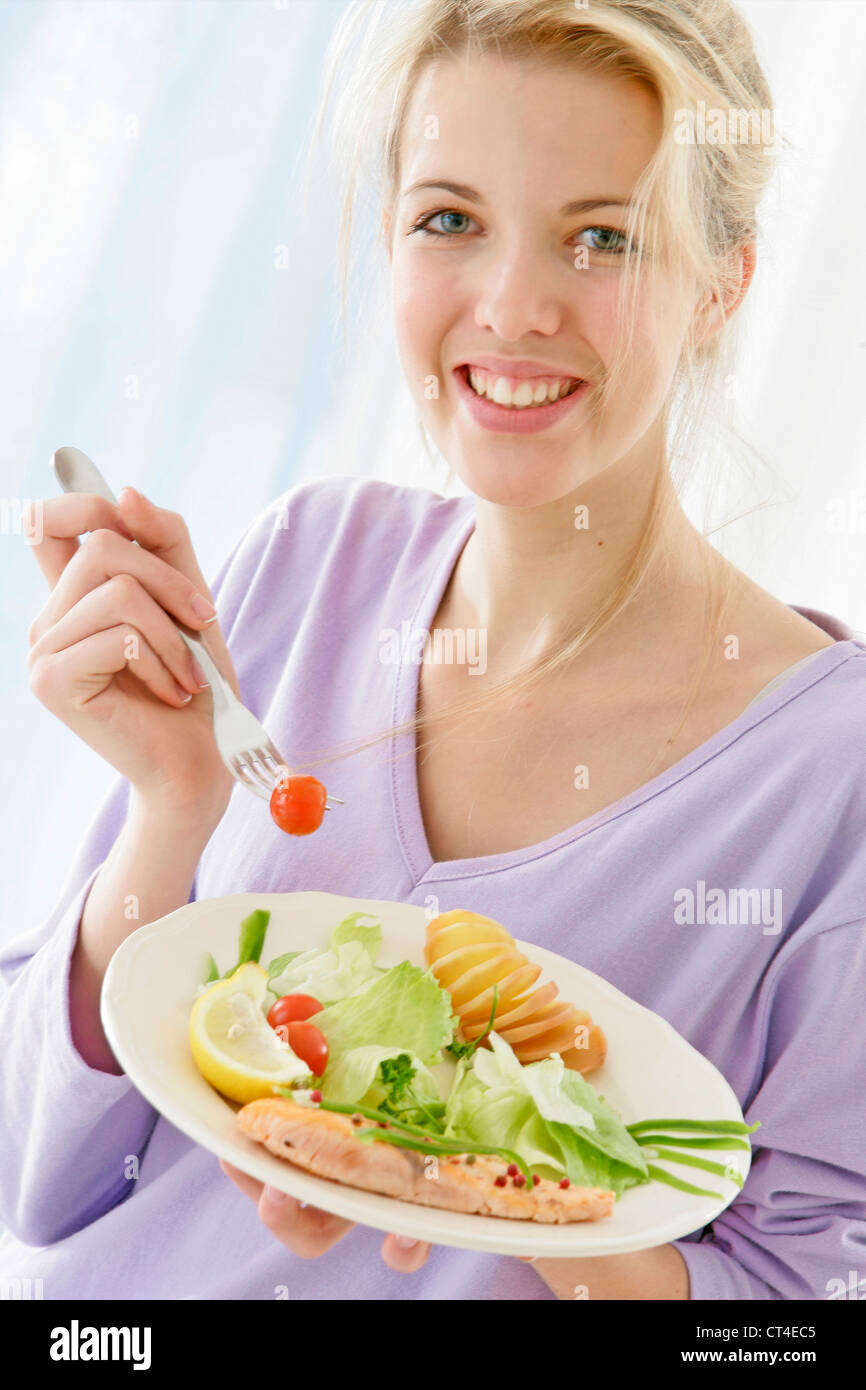 ADOLESCENT EATING A MEAL Stock Photo - Alamy