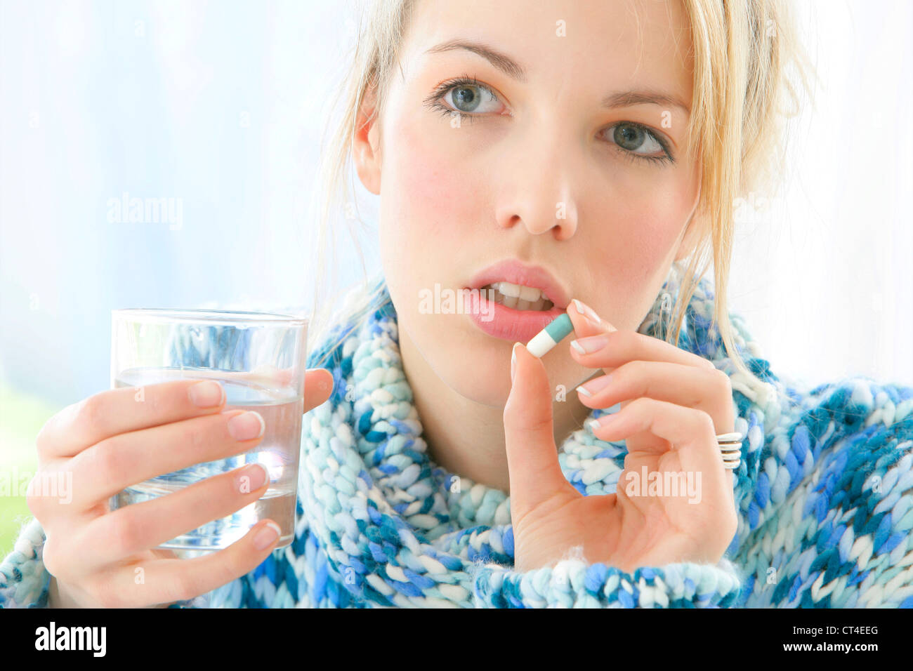WOMAN TAKING MEDICATION Stock Photo - Alamy