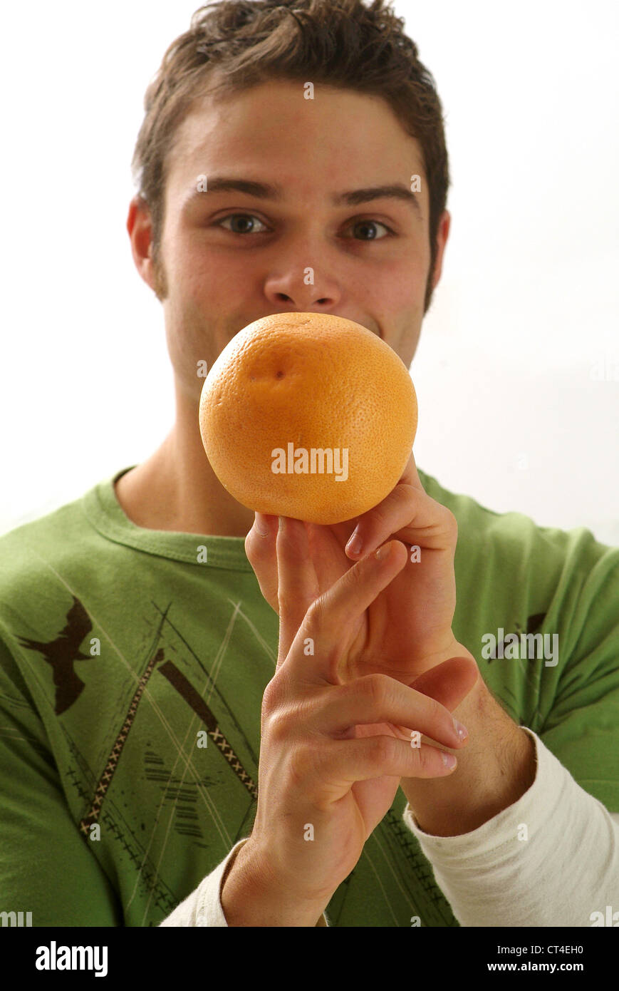MAN EATING FRUIT Stock Photo - Alamy