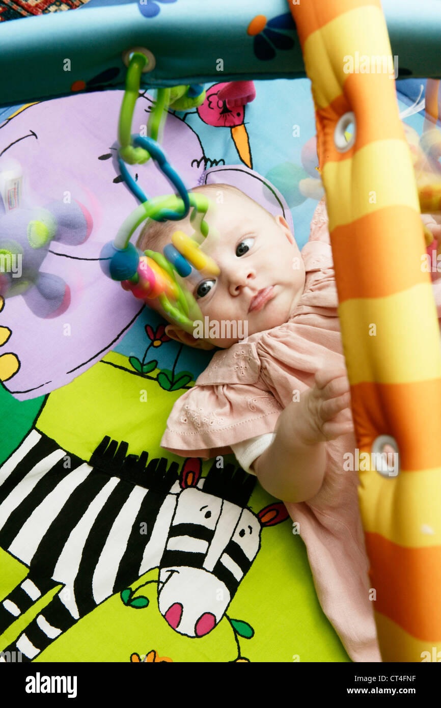 INFANT PLAYING INDOORS Stock Photo - Alamy