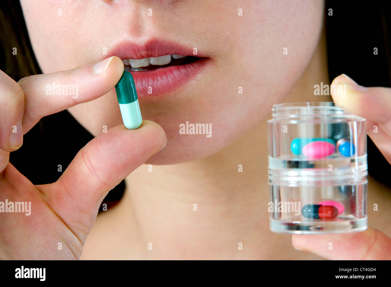 WOMAN TAKING MEDICATION Stock Photo - Alamy