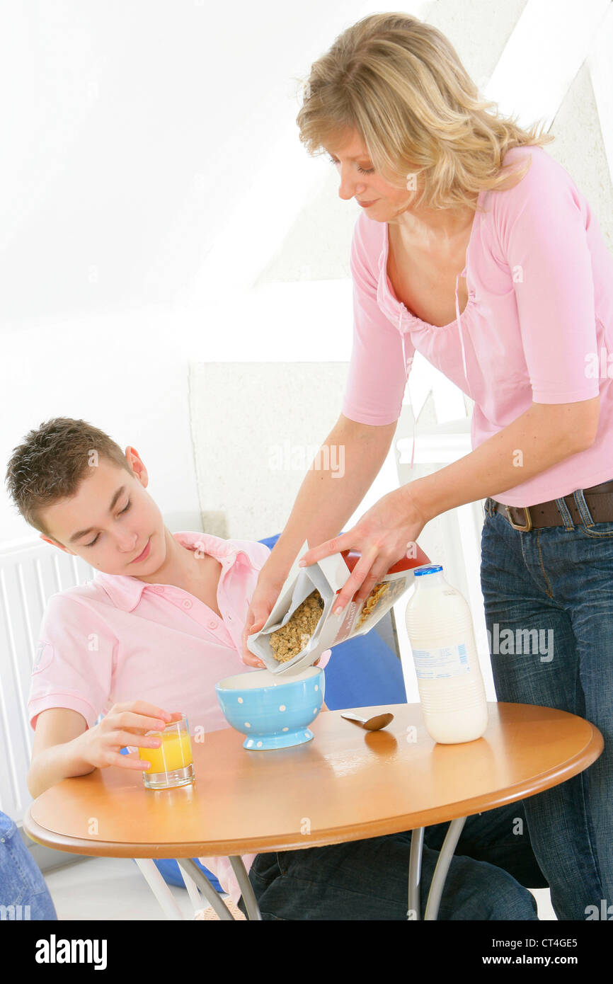 ADOLESCENT EATING BREAKFAST Stock Photo - Alamy