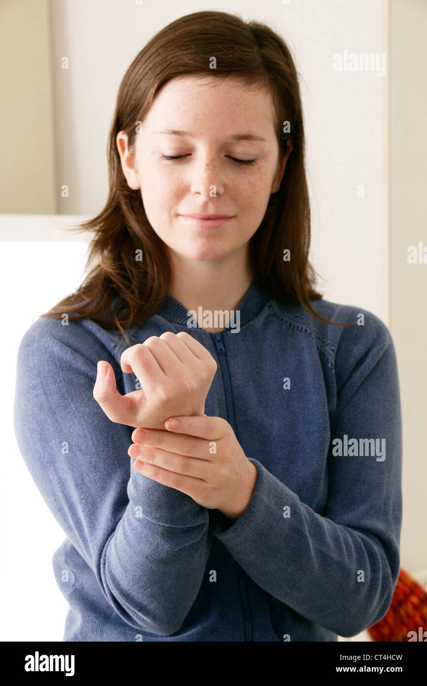 TAKING A WOMAN'S PULSE Stock Photo - Alamy