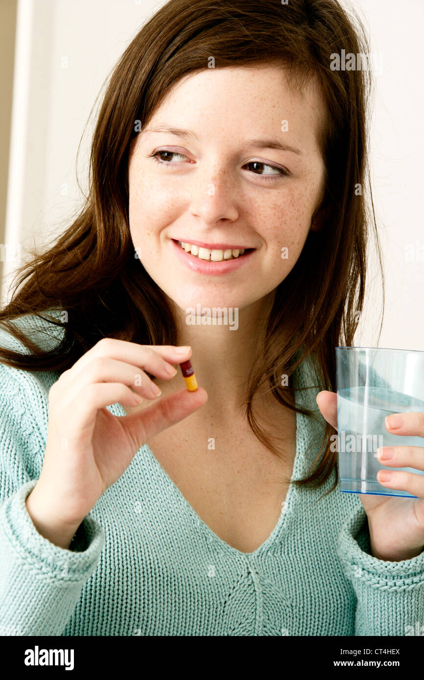 WOMAN TAKING MEDICATION Stock Photo - Alamy