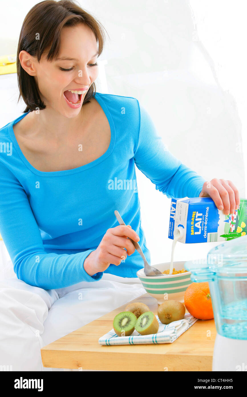 WOMAN EATING BREAKFAST Stock Photo - Alamy