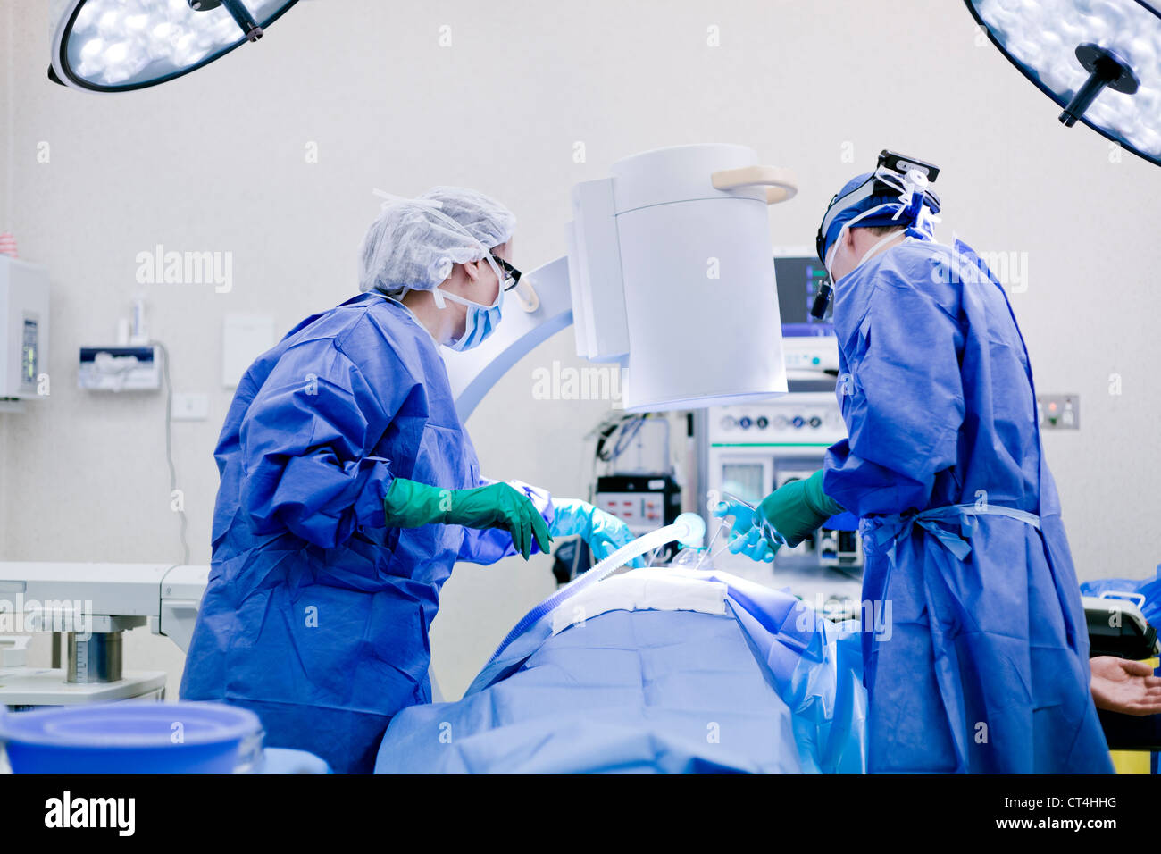 Surgeon and nurse in operating theatre Stock Photo - Alamy