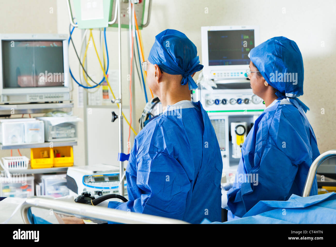 Surgery with operating table, nurses and surgeon Stock Photo - Alamy