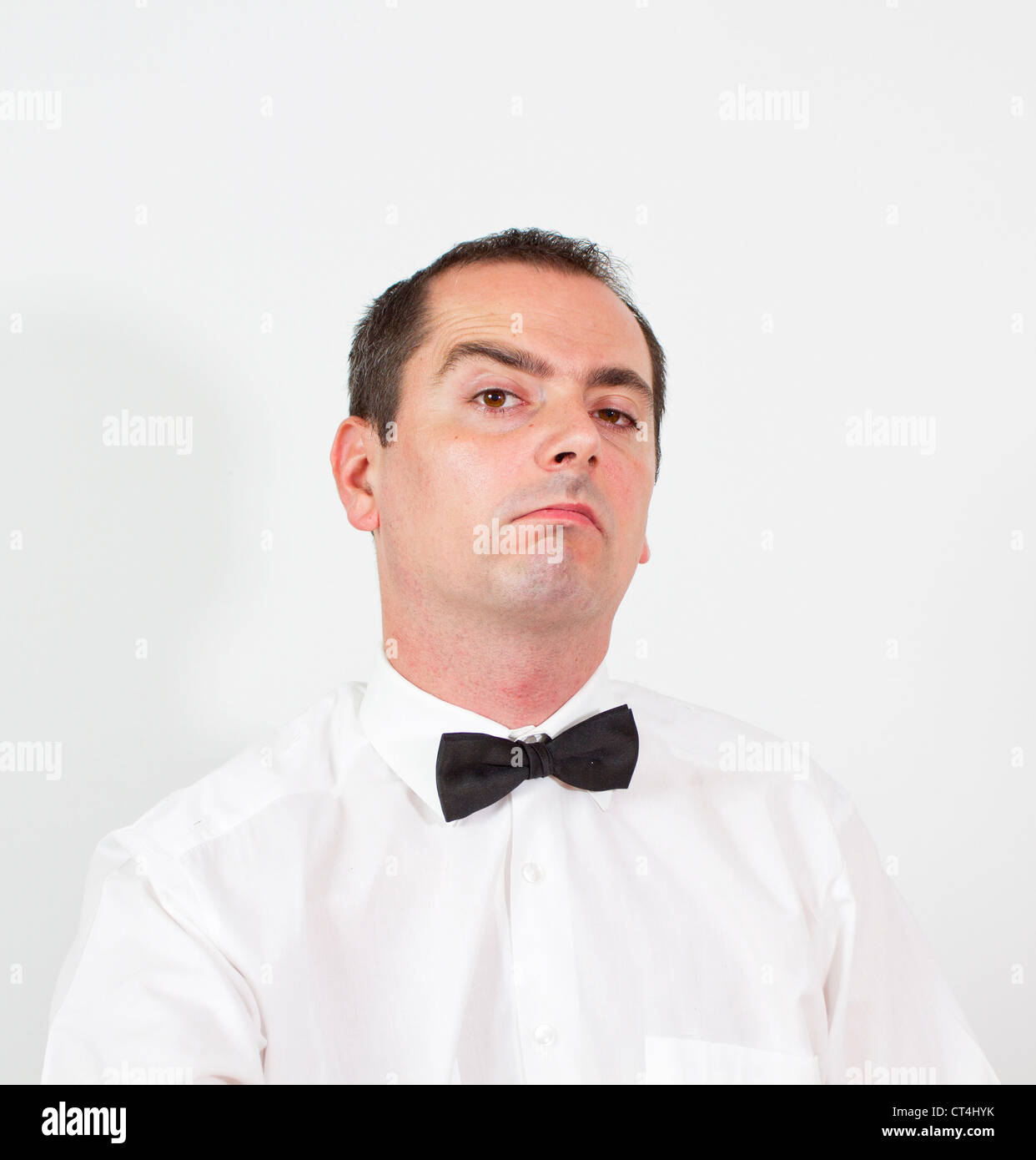 Portrait of guy with bow tie and strange face expression Stock Photo ...