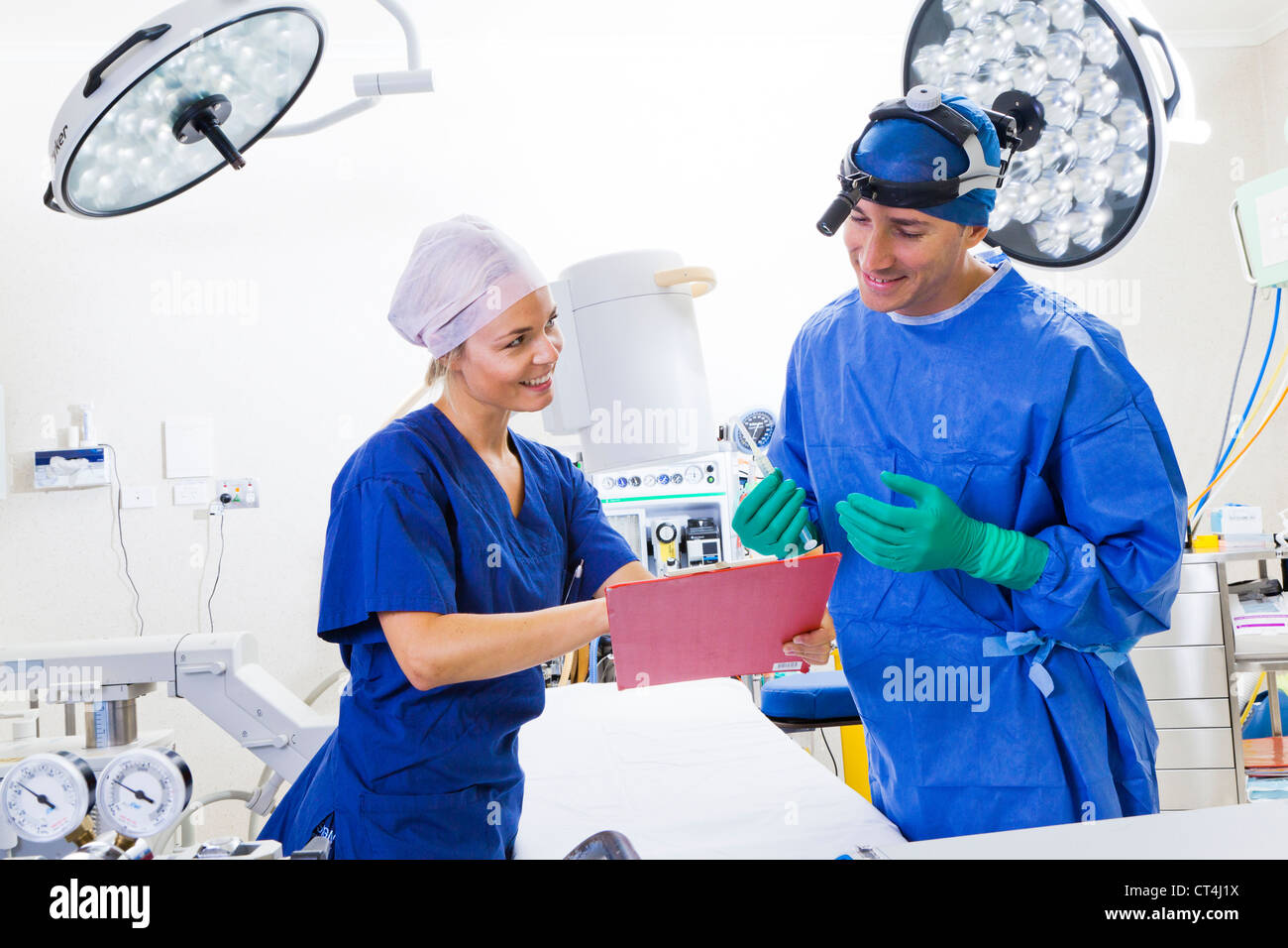 Surgeon and nurse in operating theatre Stock Photo - Alamy