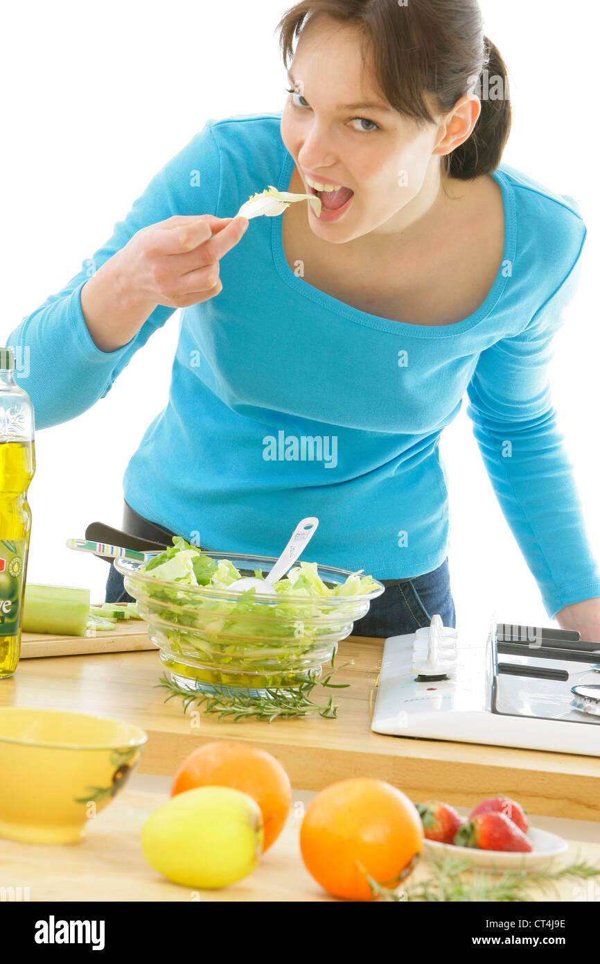 WOMAN EATING RAW VEGETABLES Stock Photo - Alamy