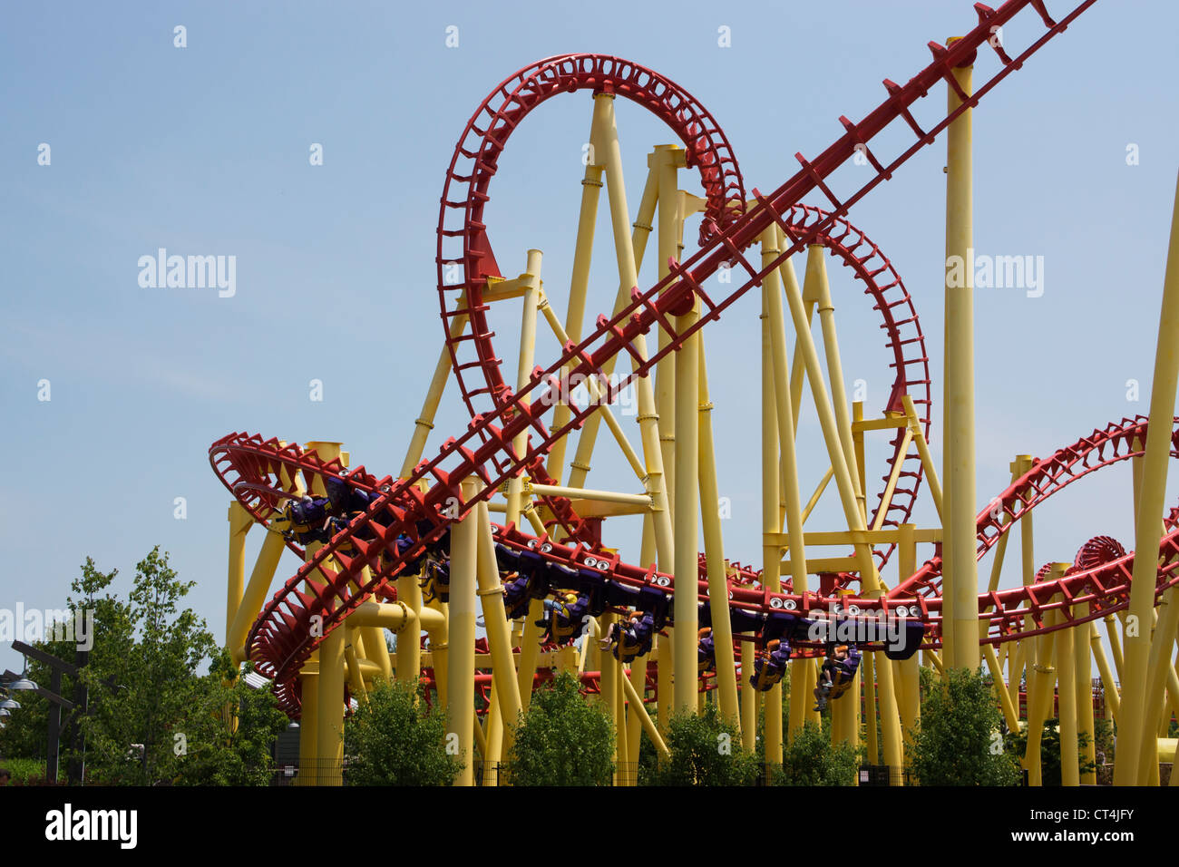 Riders serpentine through the course of the Thunderhawk roller coaster ...