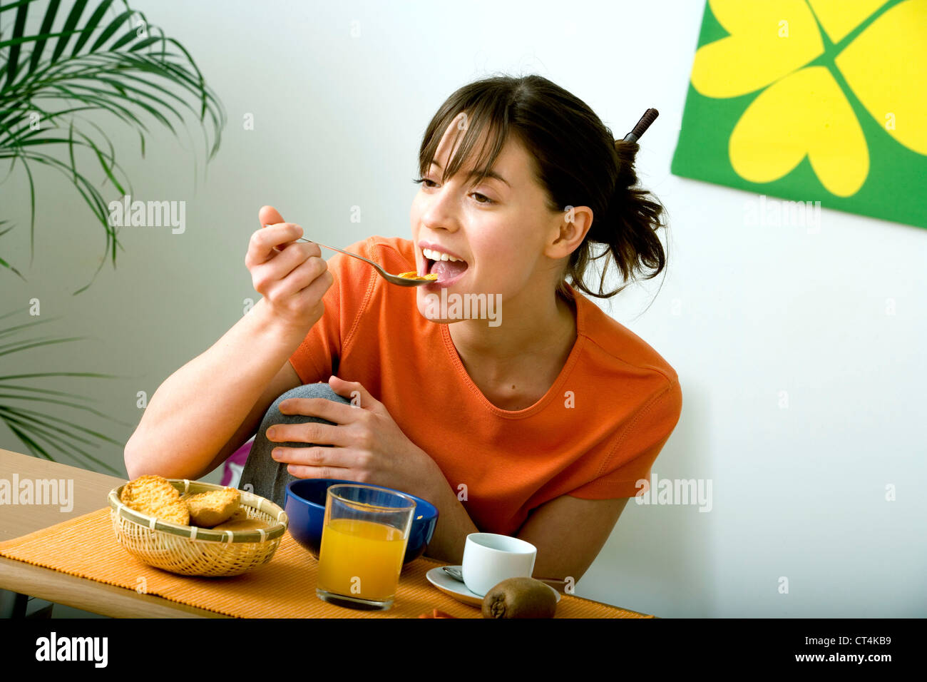 WOMAN EATING BREAKFAST Stock Photo - Alamy