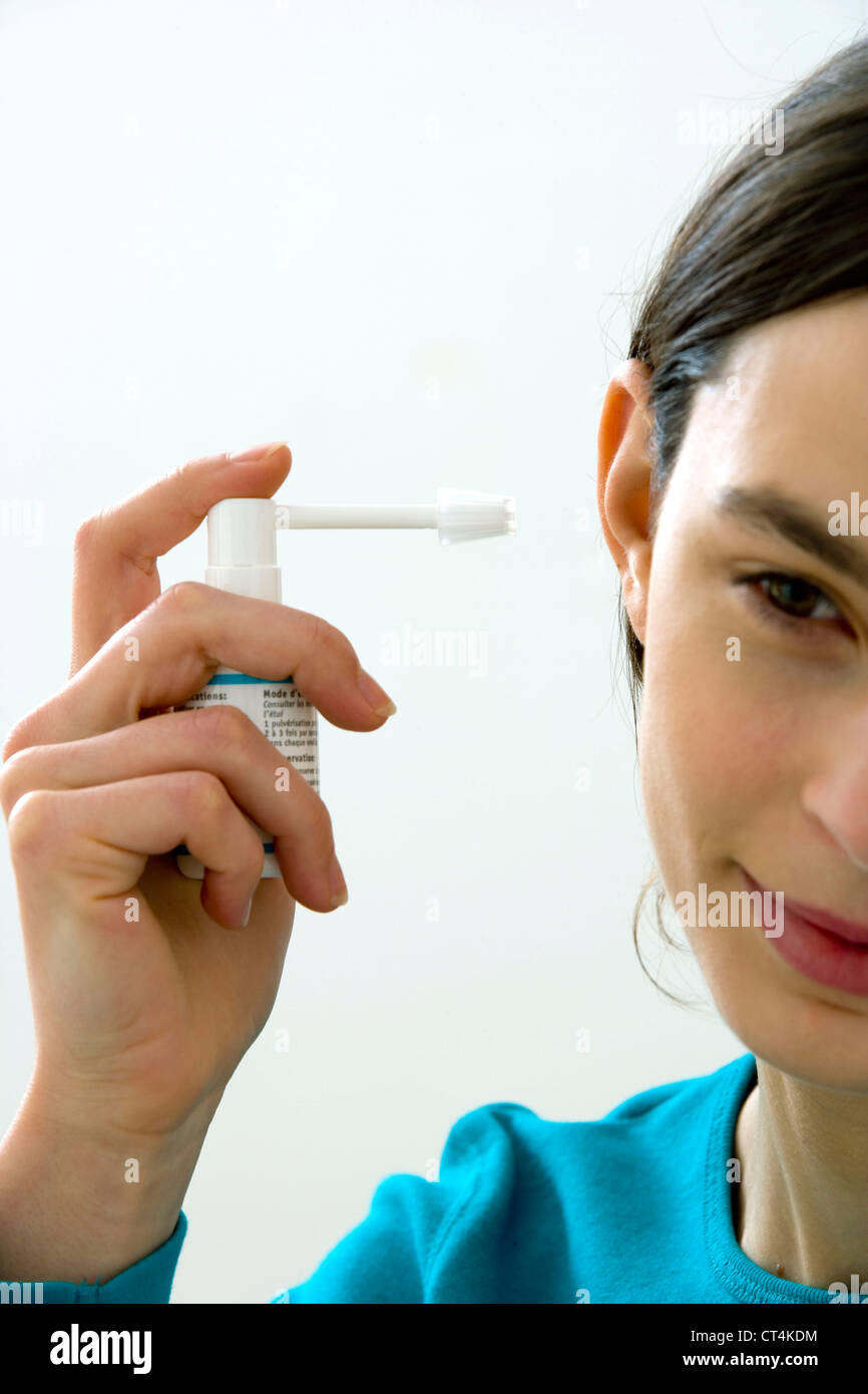 WOMAN CLEANING EARS Stock Photo - Alamy