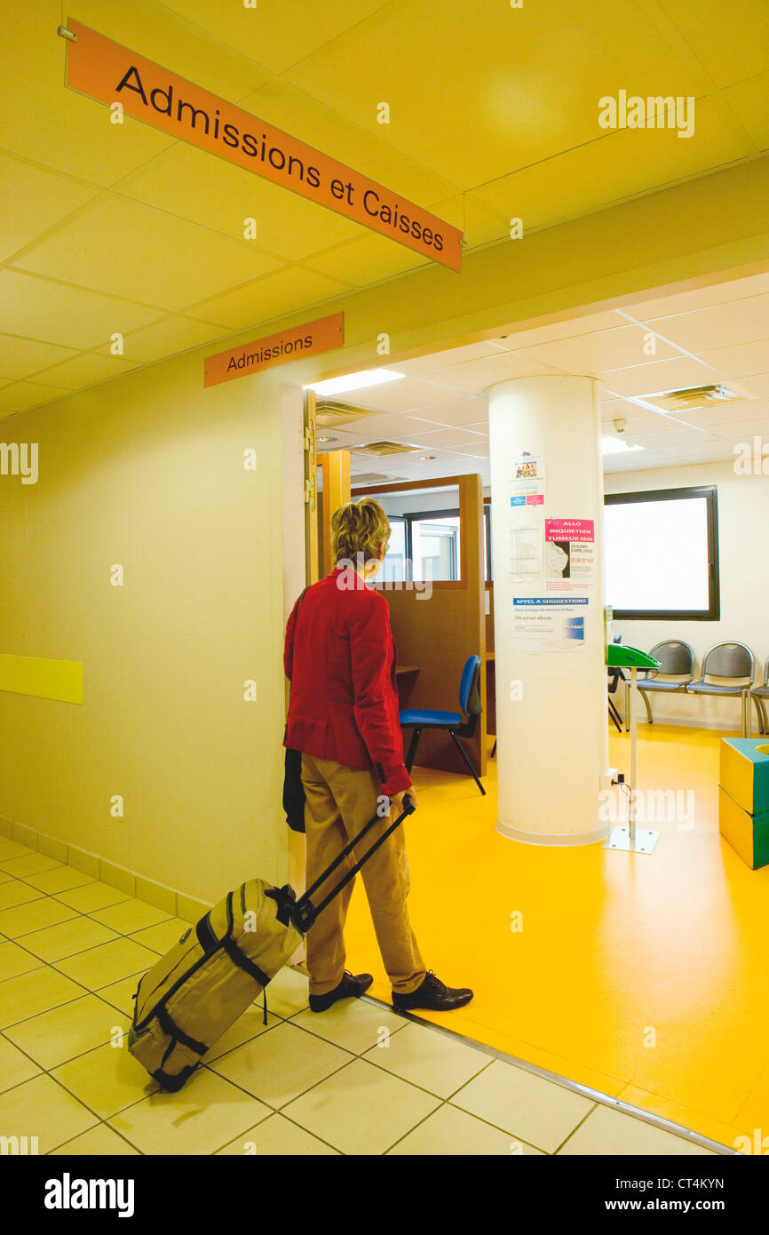 Woman coming out of hospital hi-res stock photography and images - Alamy