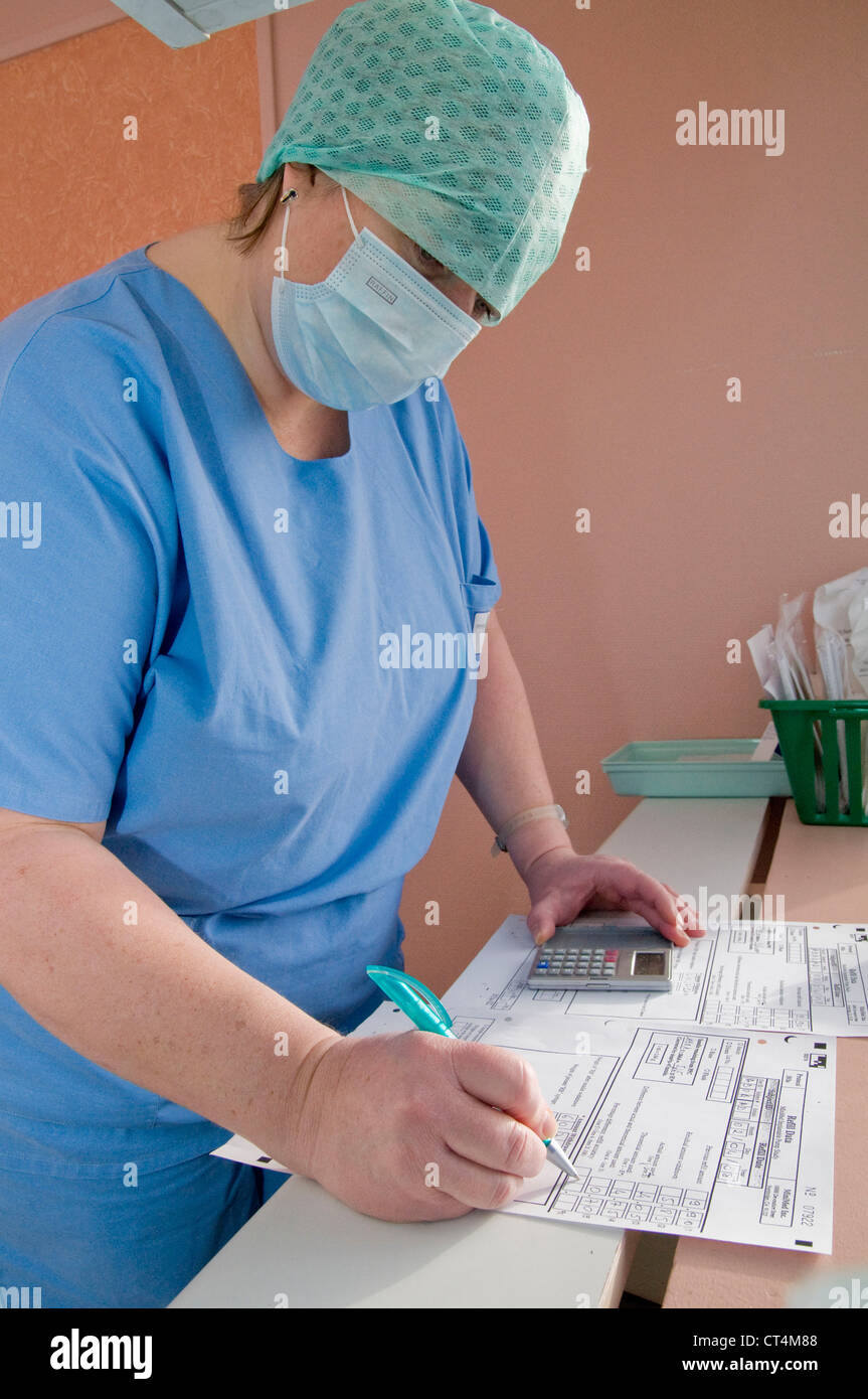 NURSE WITH PATIENT'S RECORD Stock Photo - Alamy