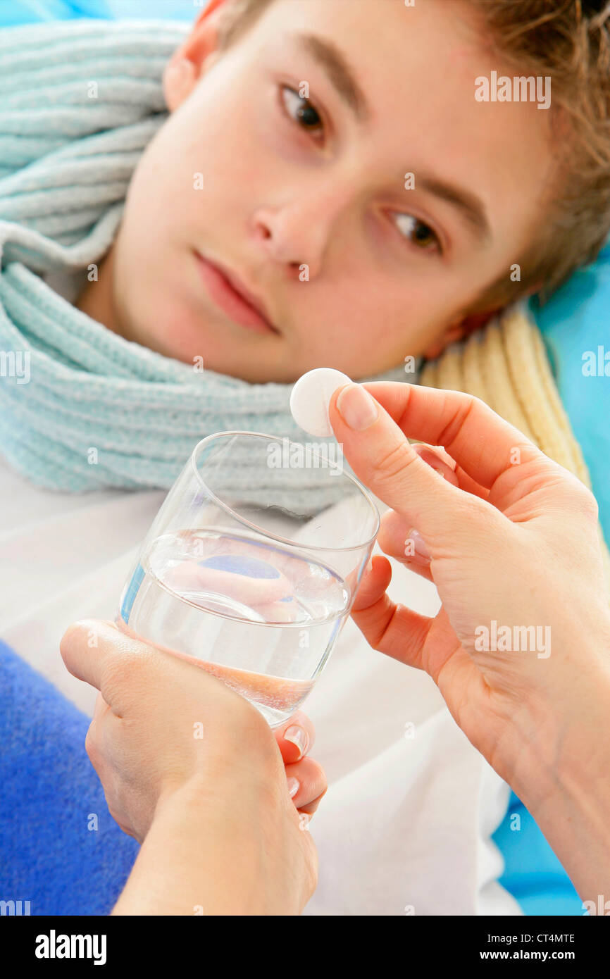 ADOLESCENT TAKING MEDICATION Stock Photo - Alamy