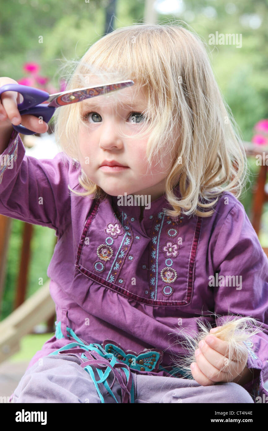 Child scissors 2 years hi-res stock photography and images - Alamy