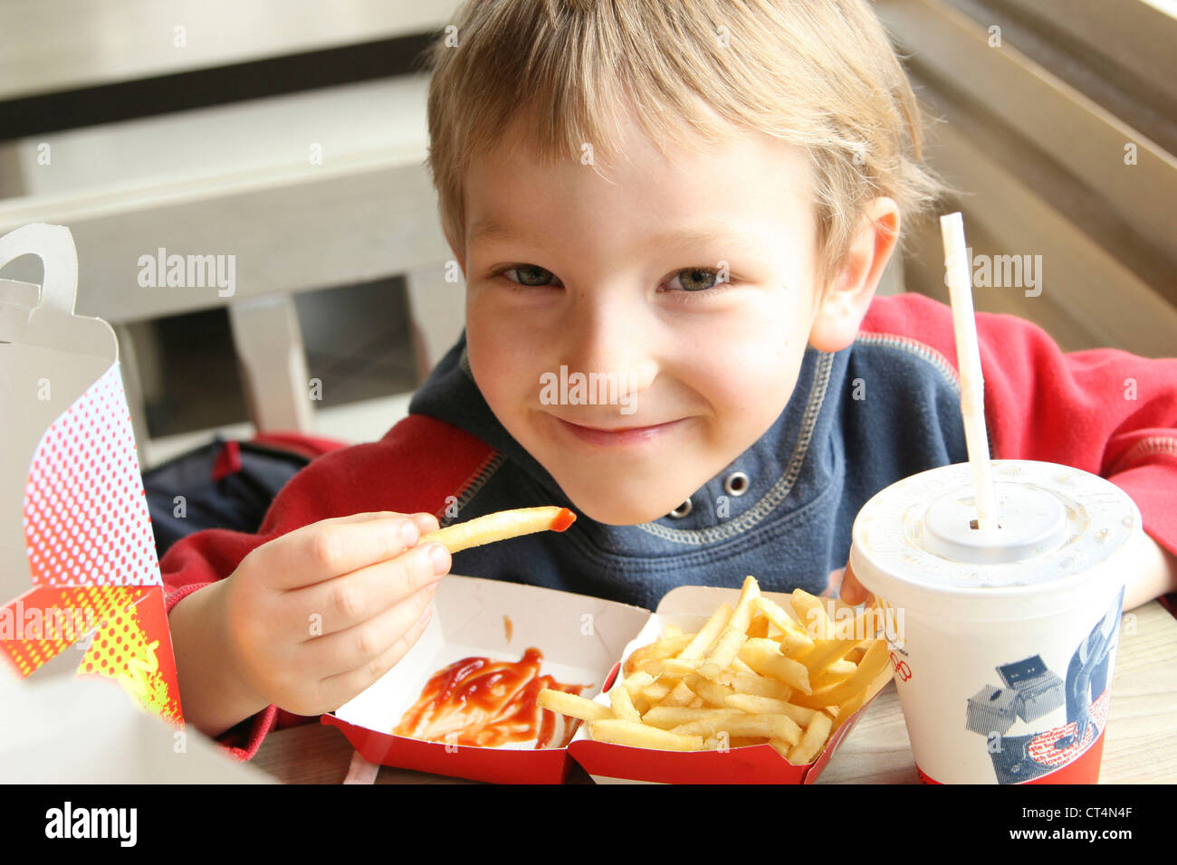 CHILD EATING A MEAL Stock Photo - Alamy