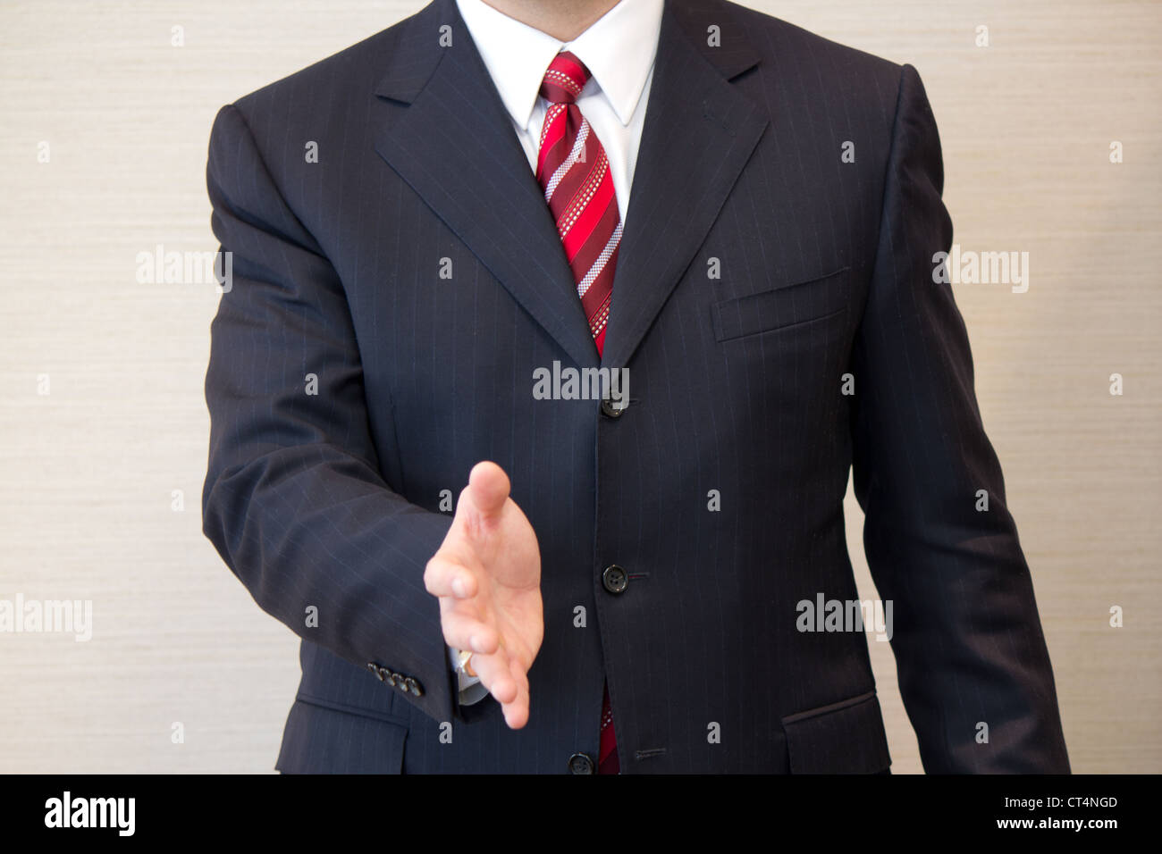 Business man offering a handshake Stock Photo - Alamy