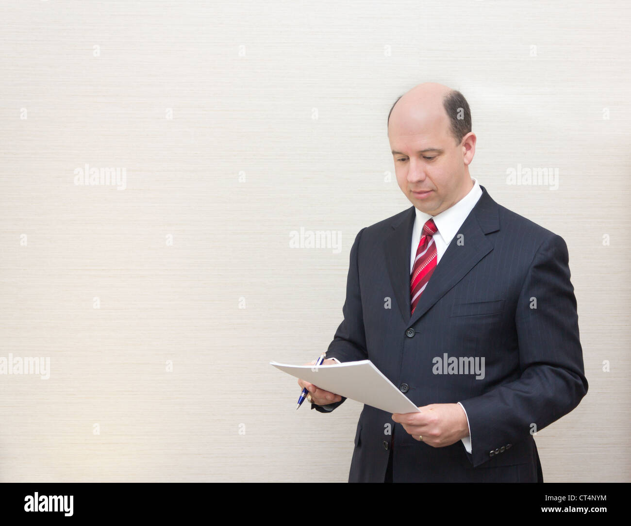 Business man reading a document Stock Photo - Alamy