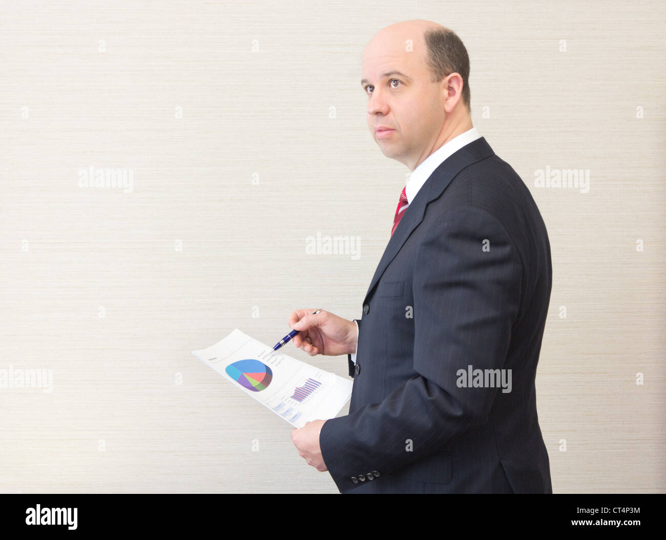 Business man holding a document Stock Photo - Alamy