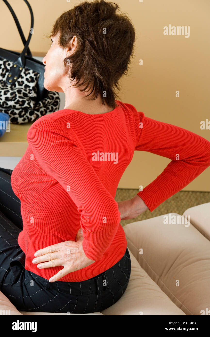 LOWER BACK PAIN IN ELDERLY PERS Stock Photo - Alamy