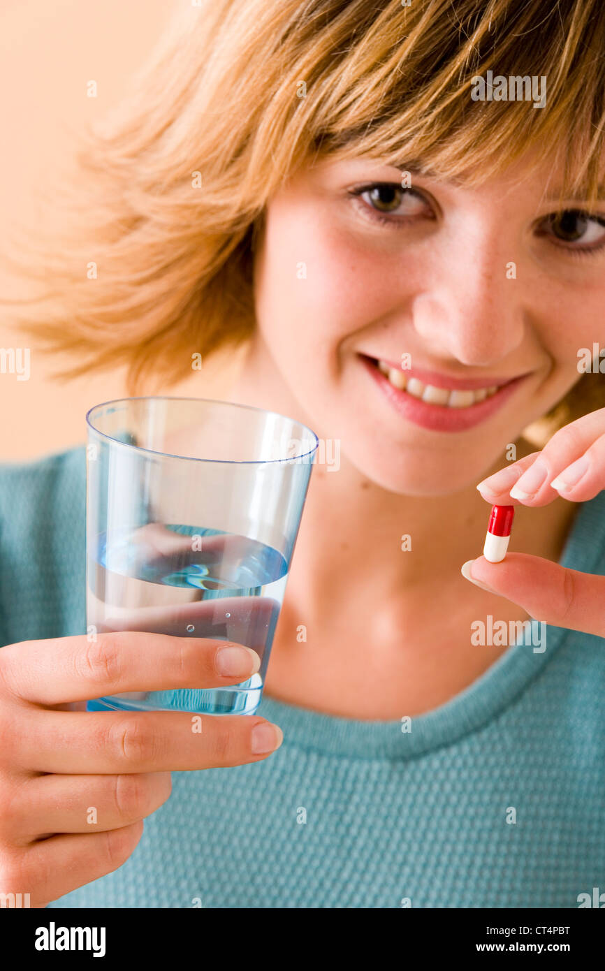 WOMAN TAKING MEDICATION Stock Photo - Alamy