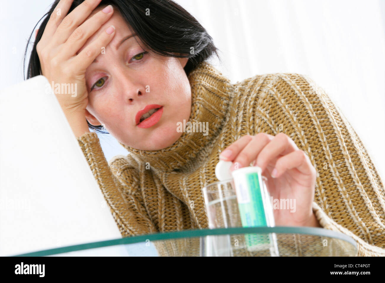 WOMAN WITH ASPIRIN Stock Photo - Alamy