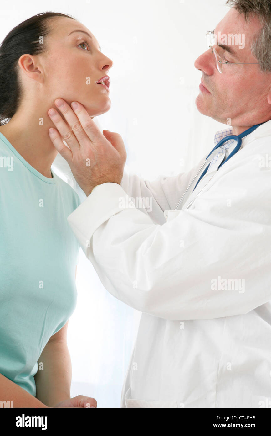 WOMAN PALPATING LYMPH NODE Stock Photo - Alamy
