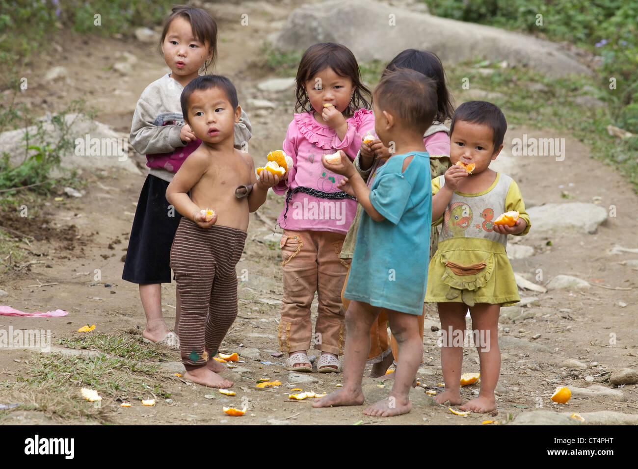 Six unidentified Vietnamese children play and eat in Sapa, Vietnam ...