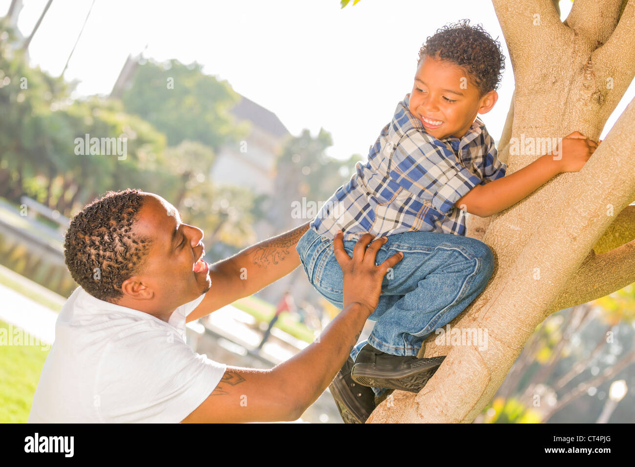 African boy climbing tree hi-res stock photography and images - Alamy