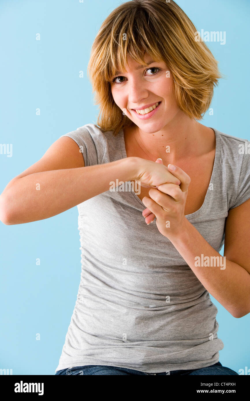 WOMAN WITH PAINFUL HAND Stock Photo - Alamy