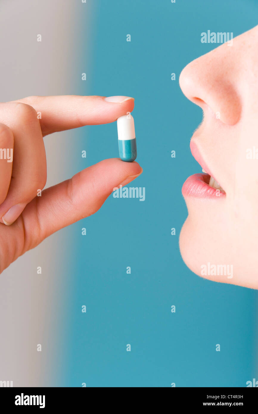 WOMAN TAKING MEDICATION Stock Photo - Alamy