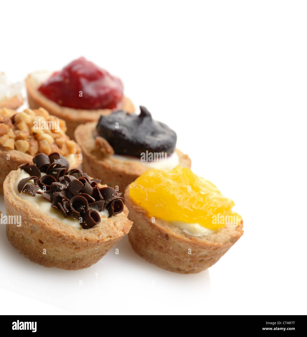 Assortment Of Small Round Cheesecakes On White Background Stock Photo ...