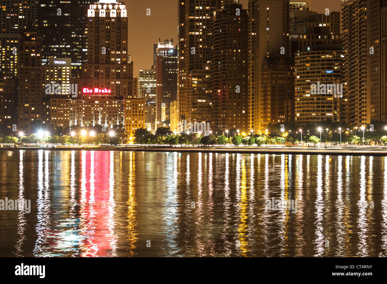 Chicago Skyline at night featuring the Drake Hotel along Lake Michigan ...