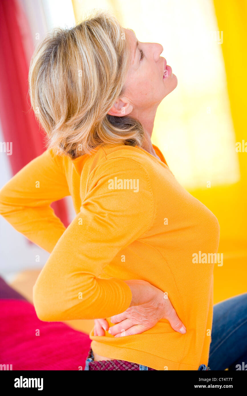 LOWER BACK PAIN IN ELDERLY PERS Stock Photo - Alamy