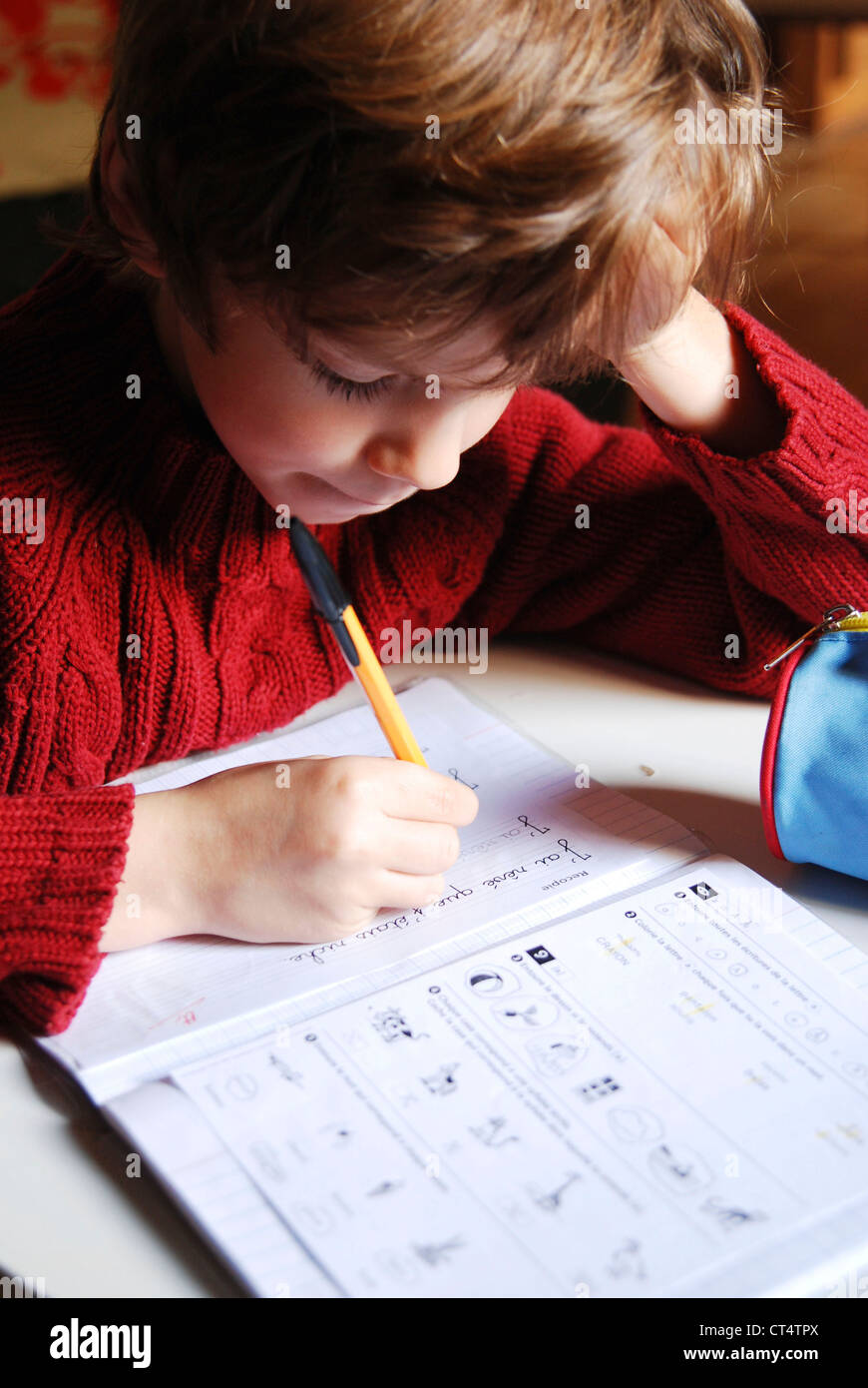 CHILD DOING HOMEWORK Stock Photo - Alamy